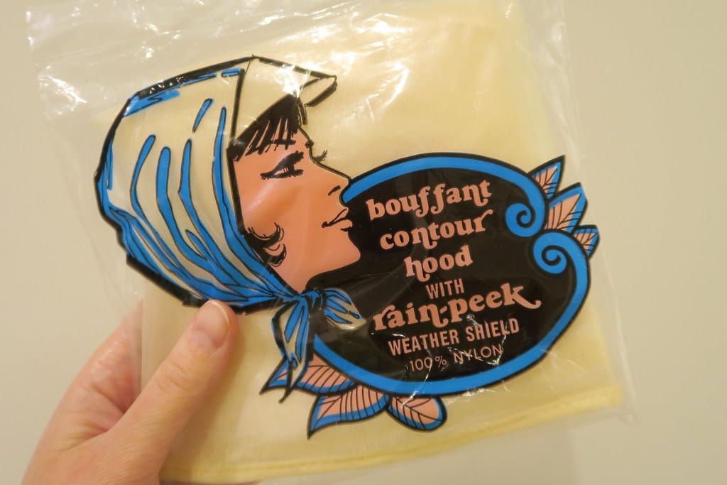 The Rain Bonnet Is Making A Fashionable Comeback From A Surprising Source